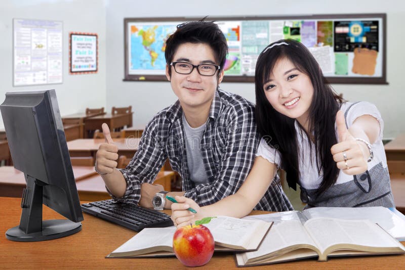 Two Students Shows Thumbs Up in the Class Stock Image - Image of ...
