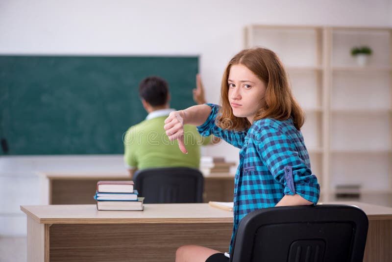 Two Students Sitting in the Classroom Stock Photo - Image of ...
