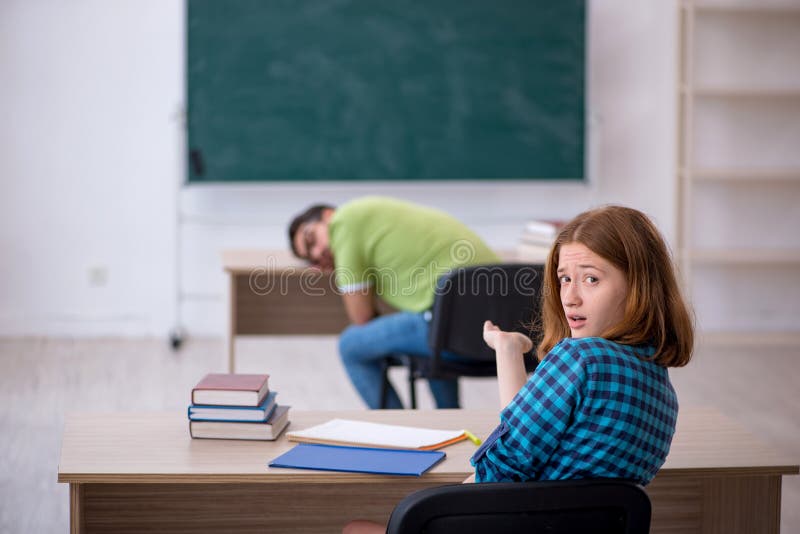 Two Students Sitting in the Classroom Stock Image - Image of learning ...