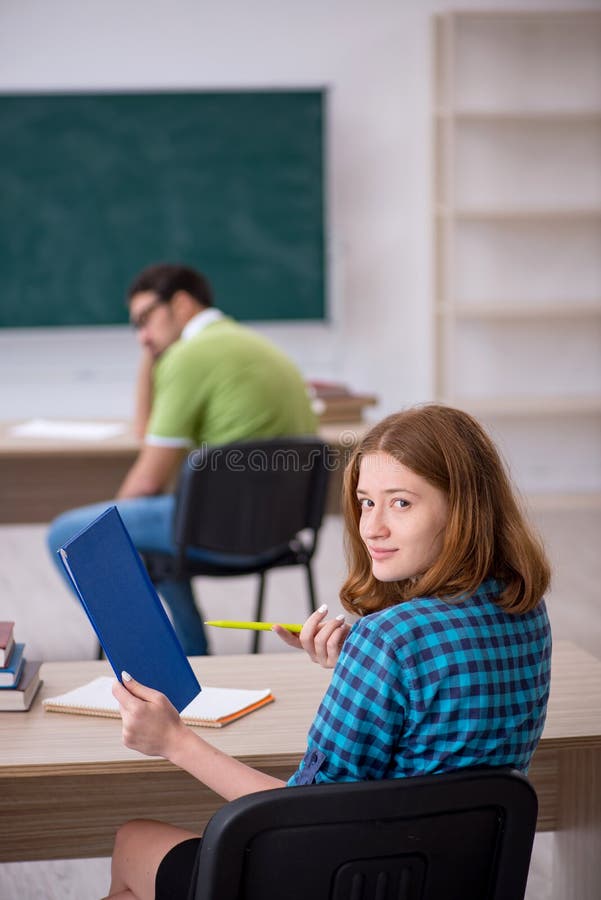 Two Students Sitting in the Classroom Stock Image - Image of graduate ...