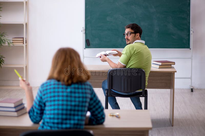 Two Students Sitting in the Classroom Stock Image - Image of graduate ...