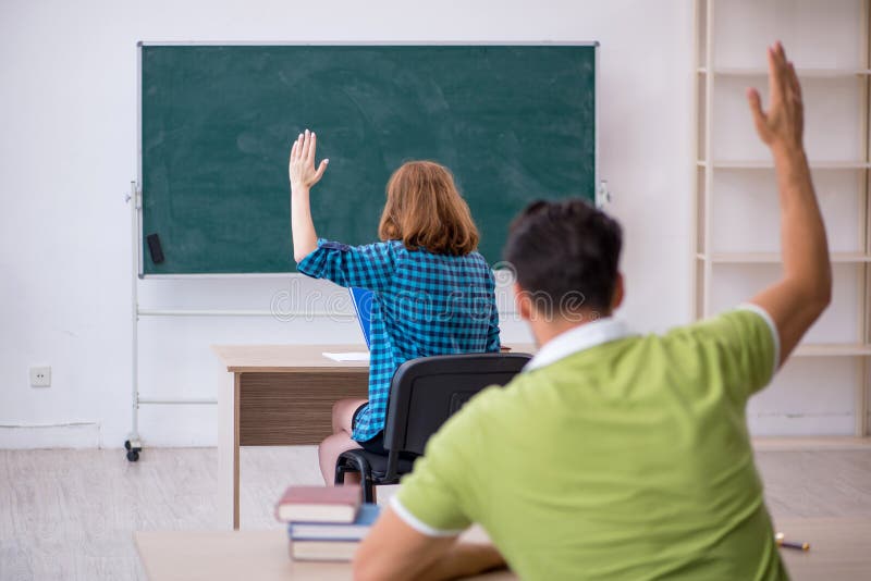 Two Students Sitting in the Classroom Stock Image - Image of education ...