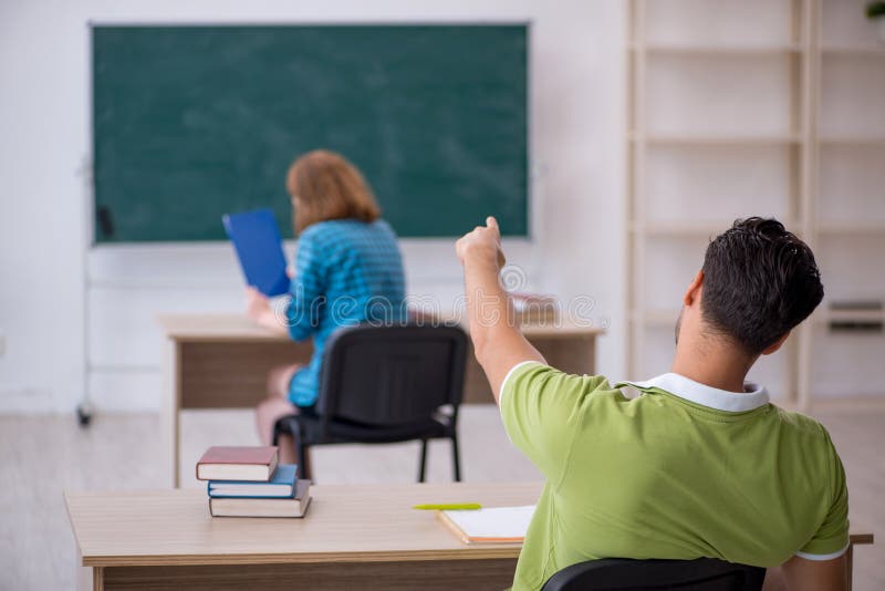 Two Students Sitting in the Classroom Stock Image - Image of high, book ...