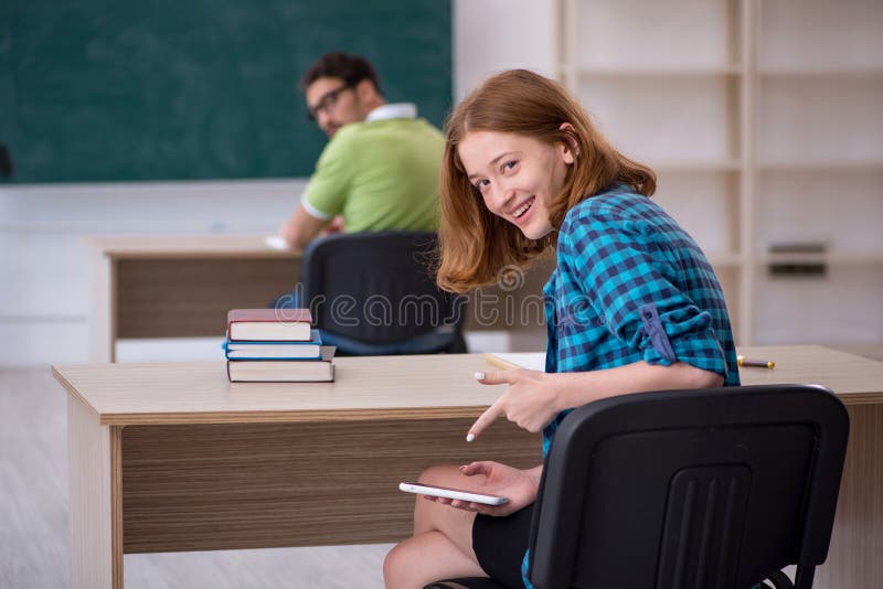 Two Students Sitting in the Classroom Stock Image - Image of online ...