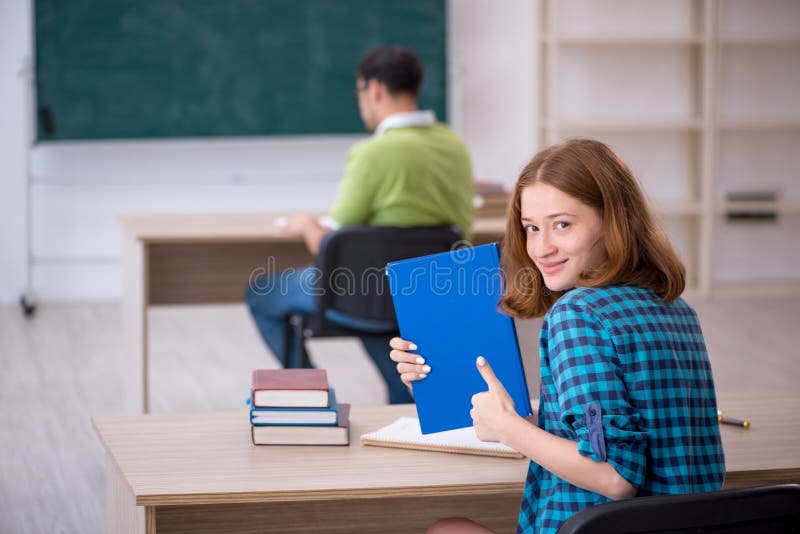 Two Students Sitting in the Classroom Stock Photo - Image of ...