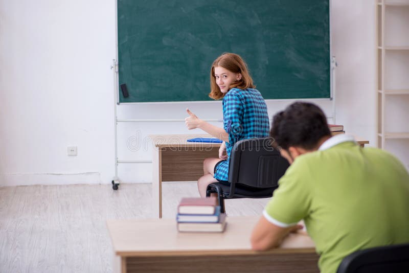 Two Students Sitting in the Classroom Stock Photo - Image of green ...