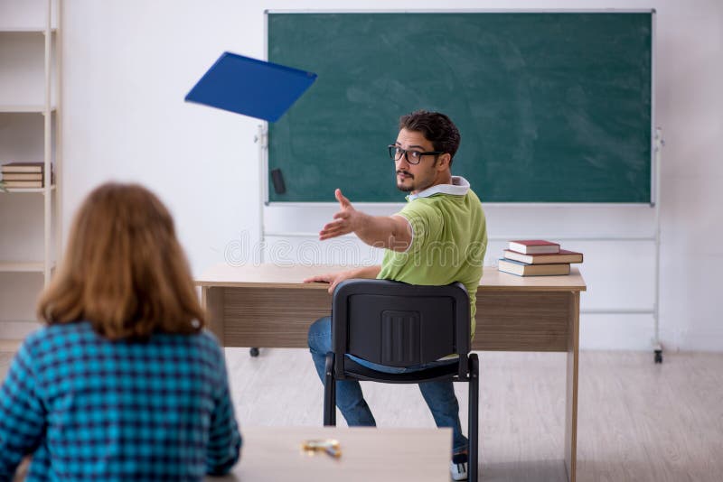 Two Students Sitting in the Classroom Stock Image - Image of exam ...