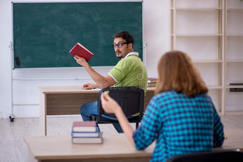 Two Students Sitting in the Classroom Stock Photo - Image of academic ...