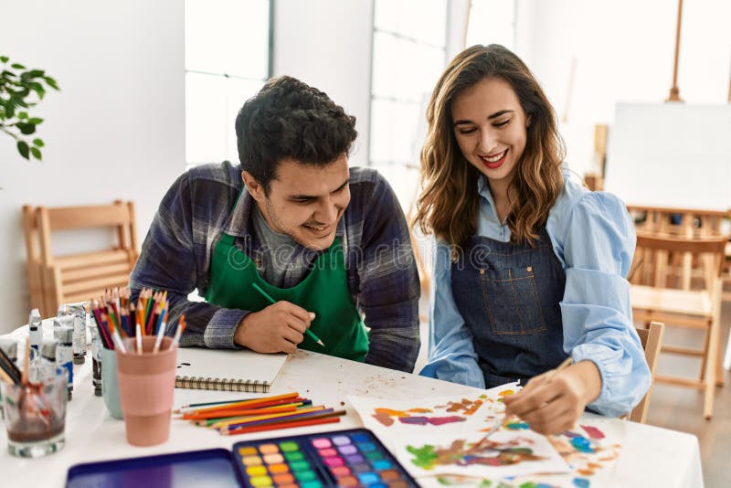 Two Students Smiling Happy Painting Sitting on the Table at Art School ...
