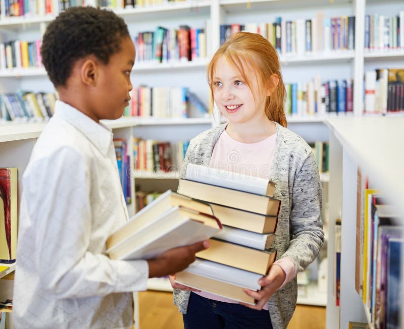 Two Students with a Stack of Books Stock Image - Image of pupil ...