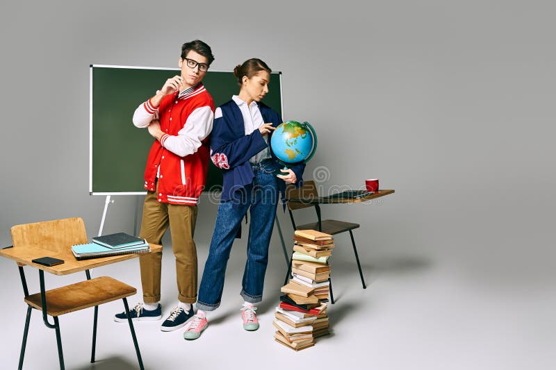 Two Students Standing at a Desk Stock Photo - Image of desk, standing ...