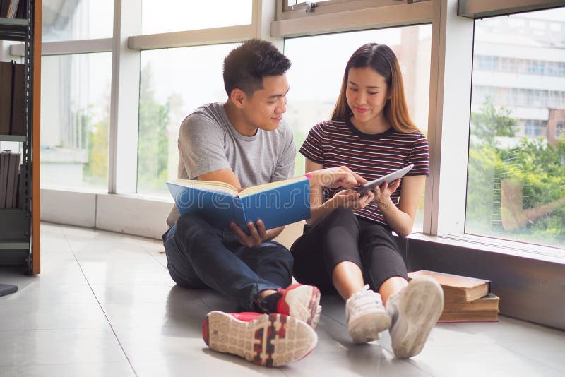 Two Students Study and Read Together in the Library Stock Image - Image ...