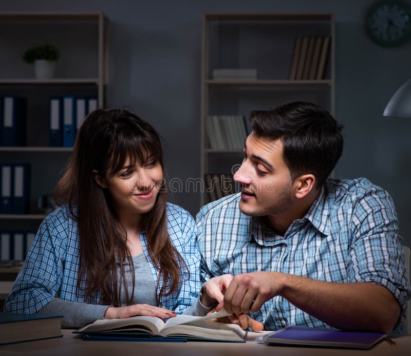 Two Students Studying Late at Night Stock Image - Image of pair, book ...