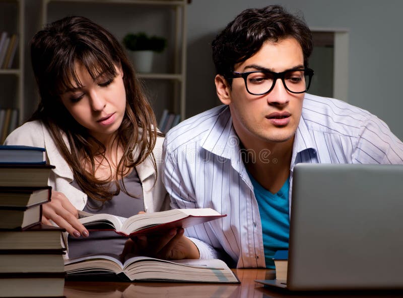 Two Students Studying Late Preparing for Exams Stock Photo - Image of ...