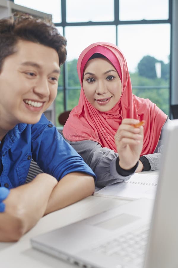 Two Students Studying Together in Library. Conceptual Image Stock Photo ...