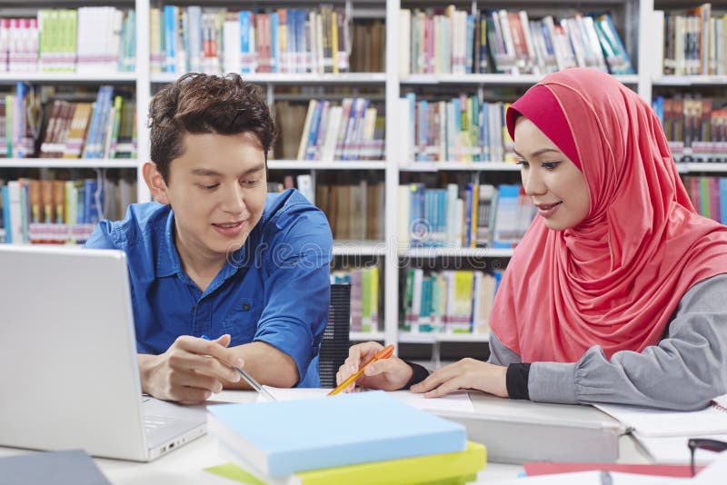 Two Students Studying Together in Library. Conceptual Image Stock Photo ...