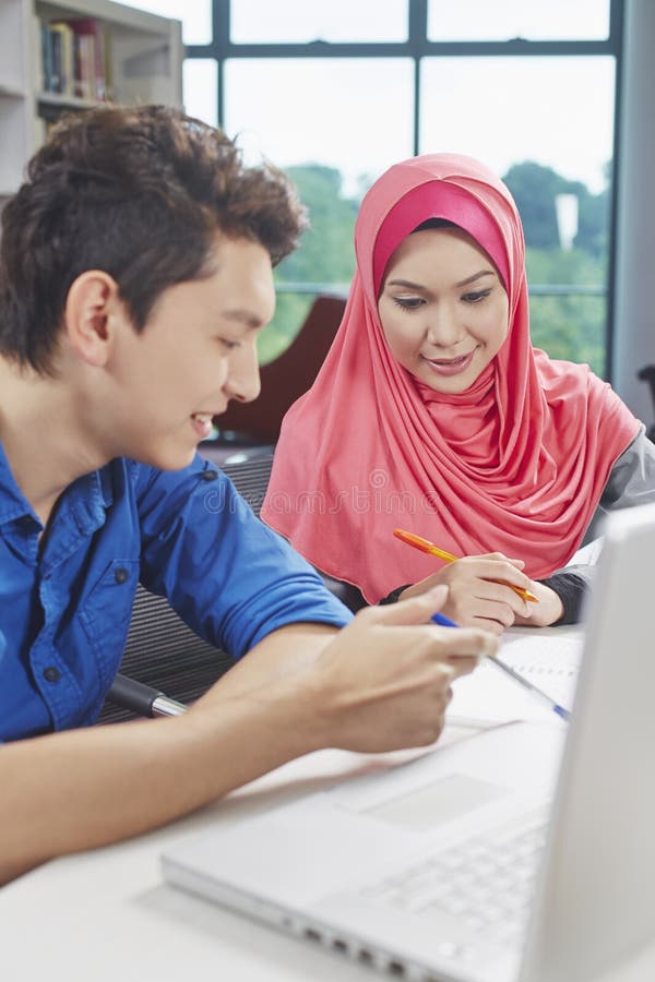 Two Students Studying Together in Library. Conceptual Image Stock Image ...
