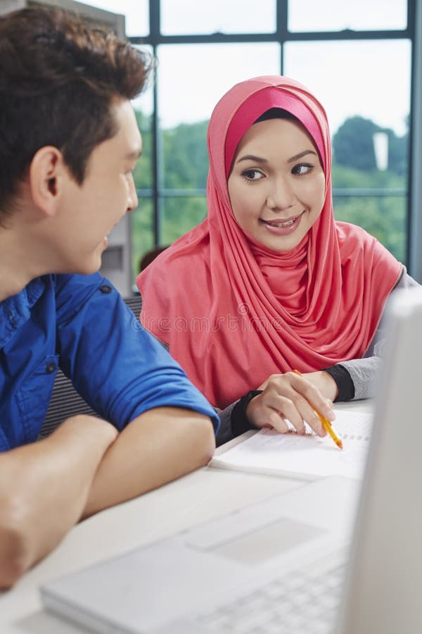 Two Students Studying Together in Library. Conceptual Image Stock Photo ...