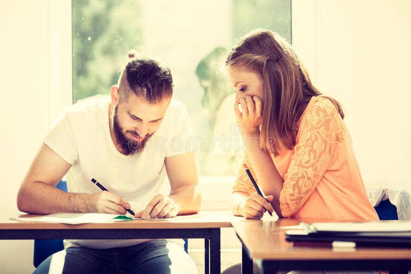 Two Students Talking in Classroom Stock Image - Image of talking ...