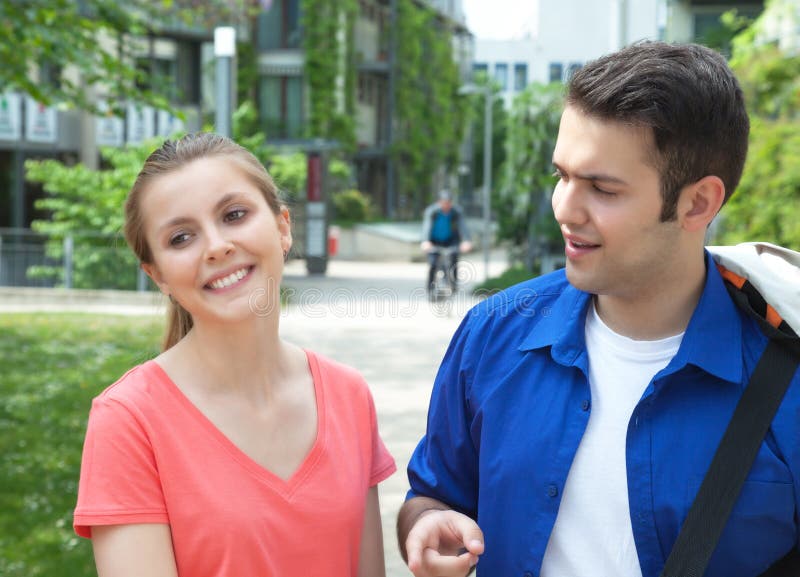Two Students Talking on Campus Stock Image - Image of class, couple ...
