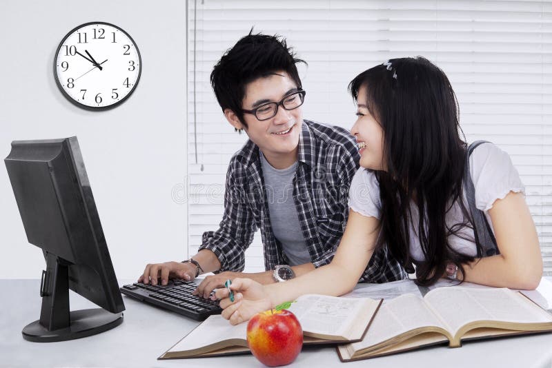 Two Students Talking and Studying Together Stock Photo - Image of ...