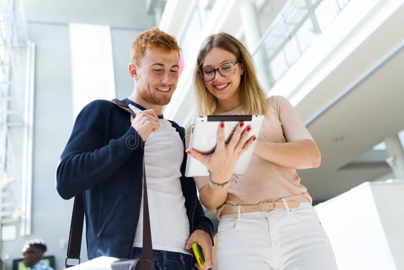 Two Students Using they Digital Tablet in a University. Stock Image ...