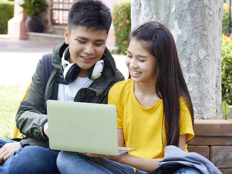 Two Students Using Laptop in the Park Stock Image - Image of university ...