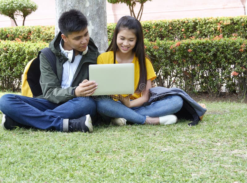 Two Students Using Laptop in the Park Stock Photo - Image of computer ...