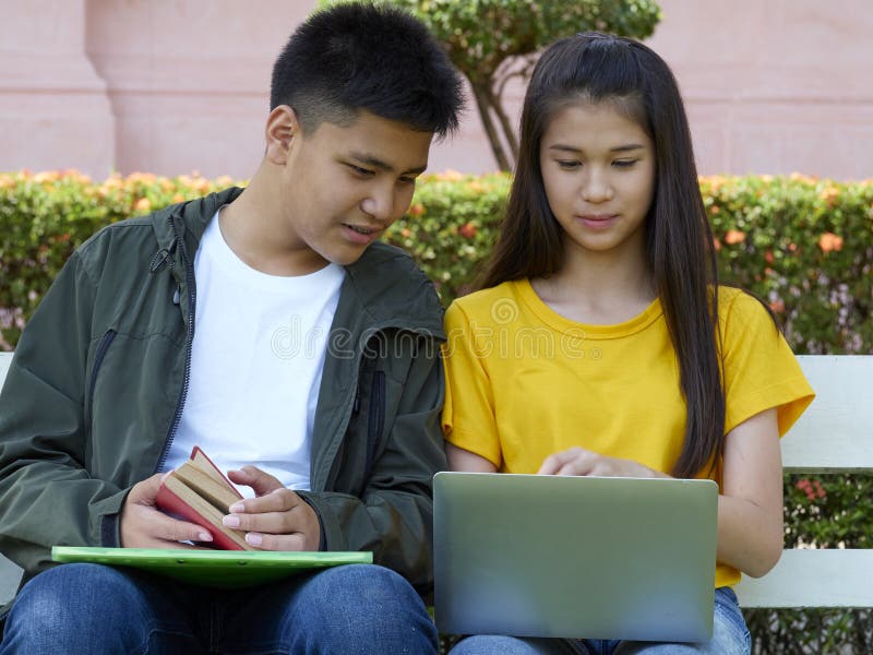 Two Students Using Laptop in the Park Stock Image - Image of caucasian ...