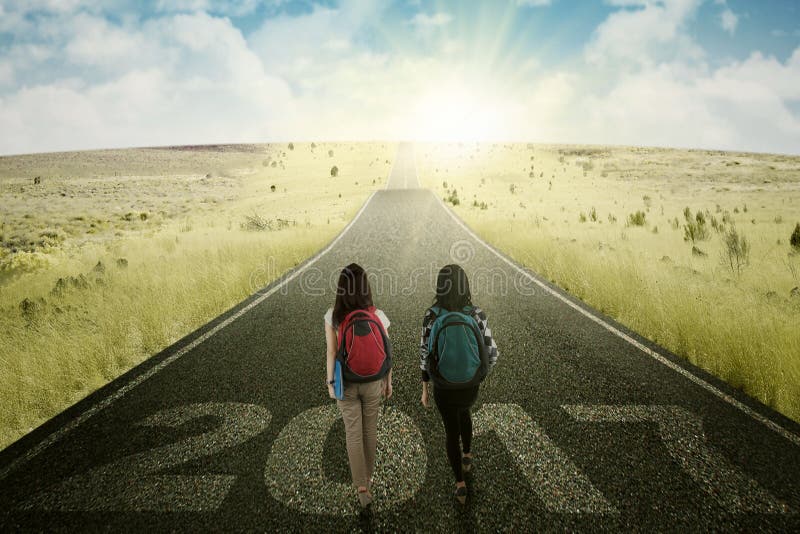 Two Students Walking with Sunrise on the Road Stock Photo - Image of ...