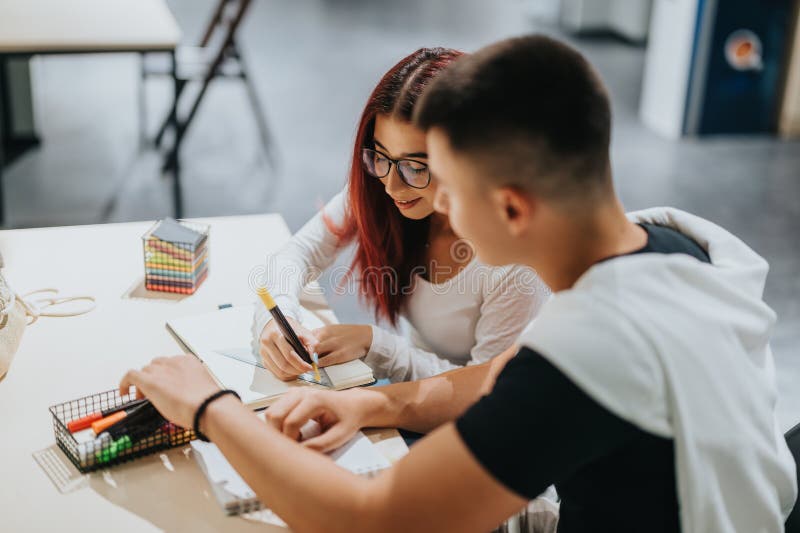 Students Collaborating at a Desk during a School Study Session Stock ...
