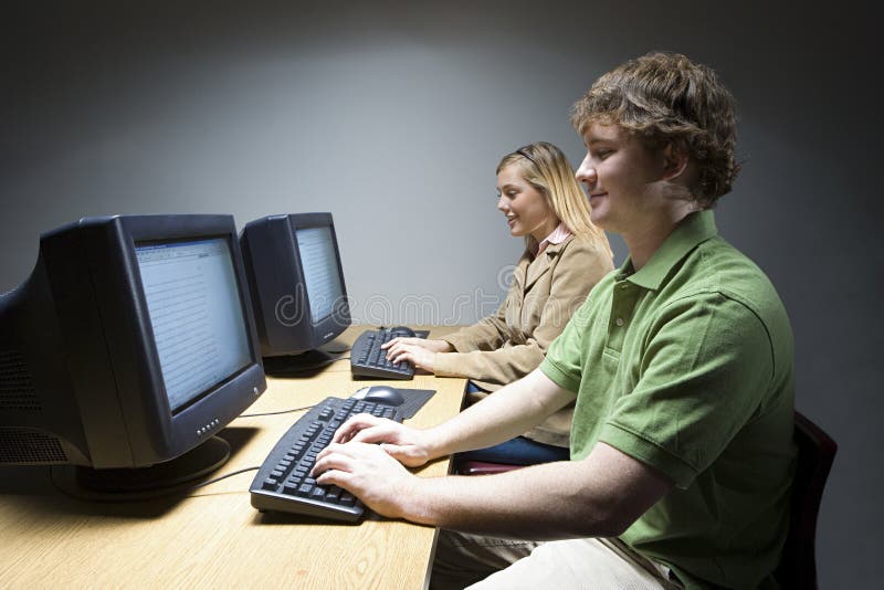 Two Students Working on Computers Stock Photo - Image of people, enjoy ... Two Students Working on Computers Stock Photo - Image of people, enjoy ...