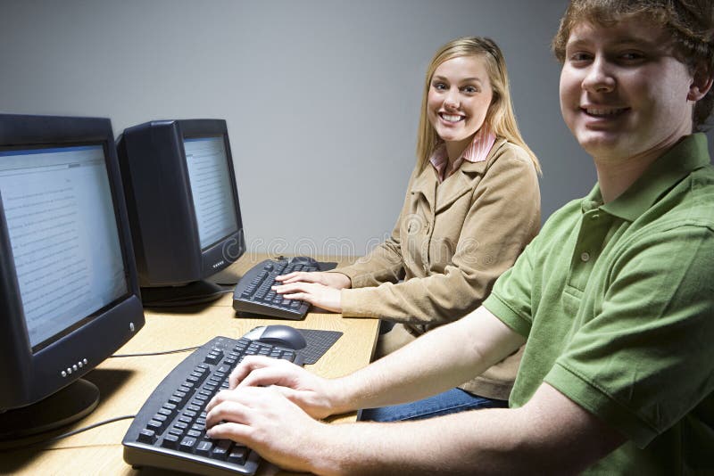 Two Students Working on Computers Stock Photo - Image of happiness ... Two Students Working on Computers Stock Photo - Image of happiness ...