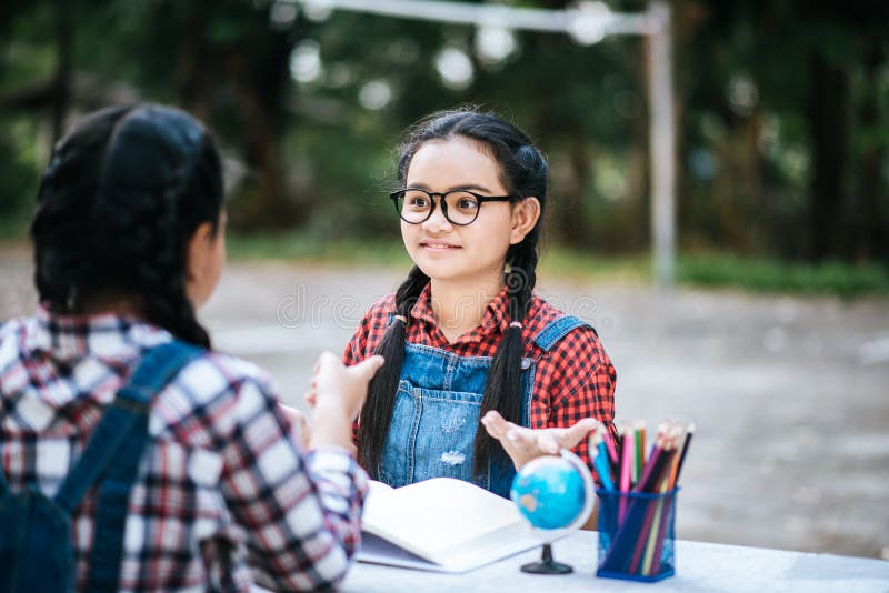 Two Study Girl Talking To Each Other Stock Photo - Image of adult ...