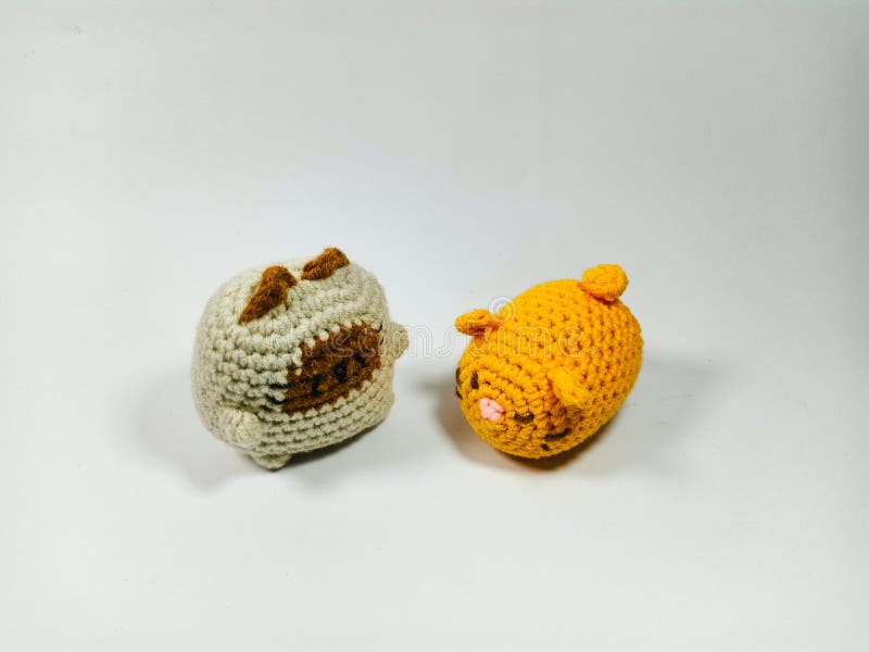 Two Stuffed Animals, One of Which is a Cat and the Other is a Rabbit ...