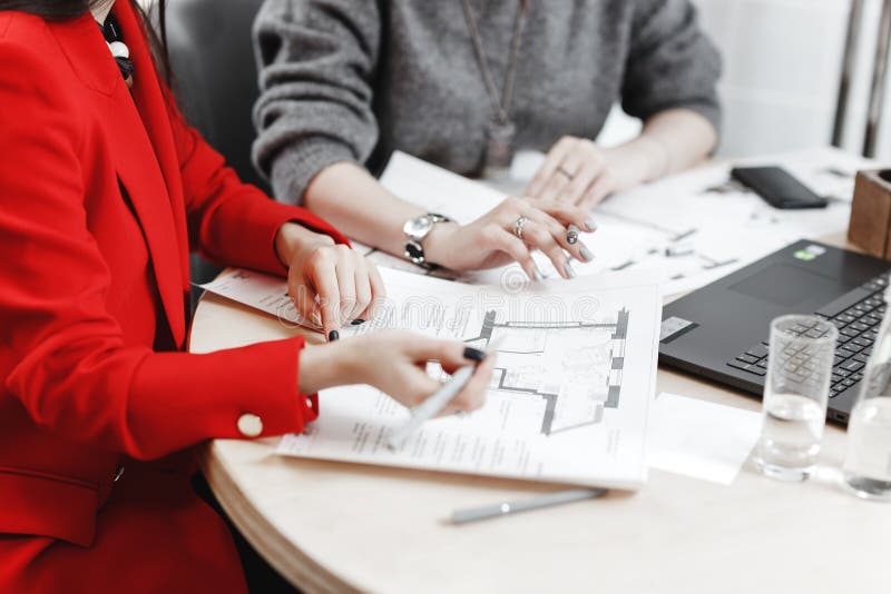 Two Stylish Girls Interior Designers Working in the Office at the ...