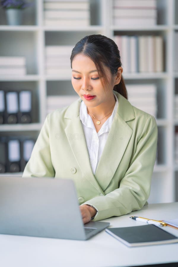 Two Successful Asian Businesswomen Working with Financial Data Graph ...