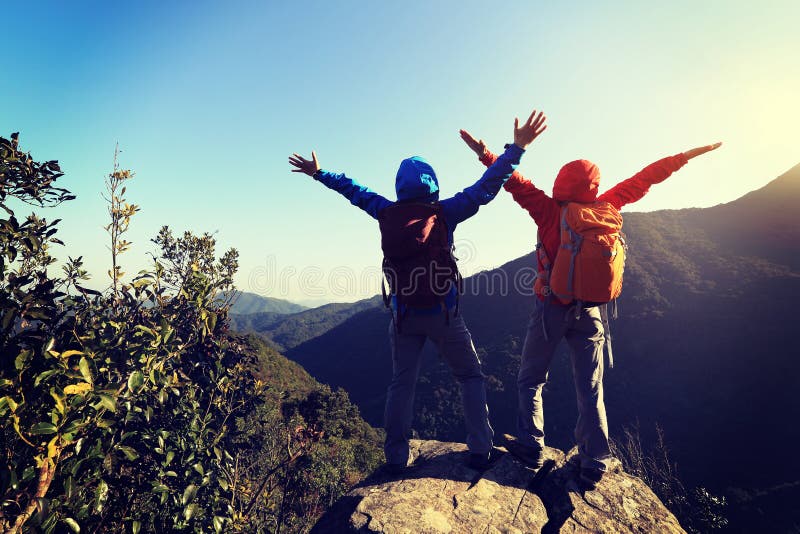 Two Successful Backpacker Open Arms at Mountain Stock Photo - Image of ...