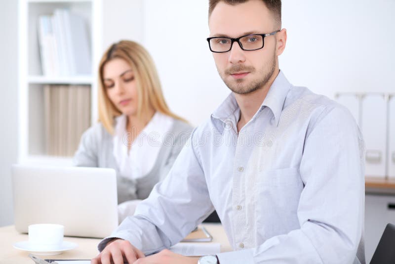 Two Successful Business Partners Working at Meeting in Office. Focus on ...