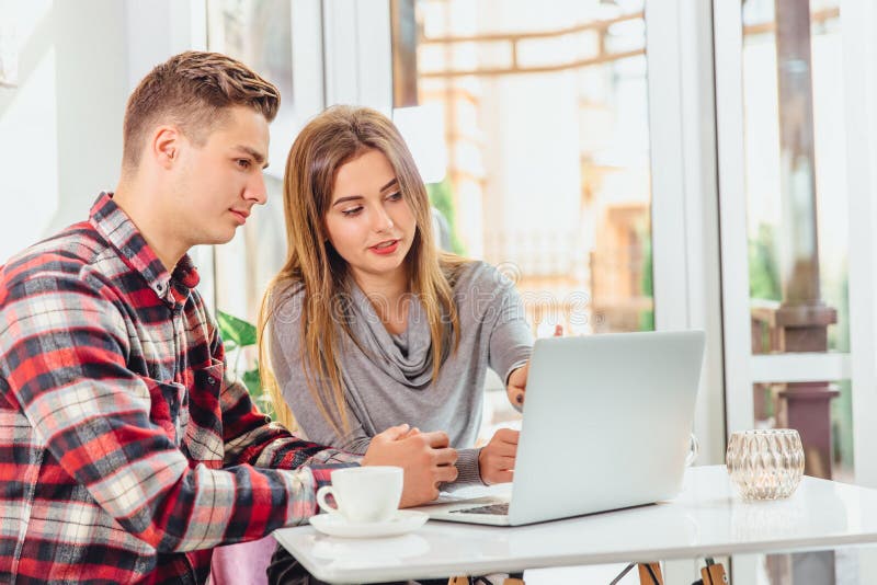 Two Successful Coleagues Working on Project in Coffee Shop. Stock Photo ...
