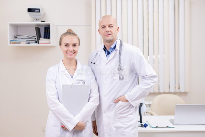 Two Successful Contemporary Clinicians in Whitecoats Standing by ...