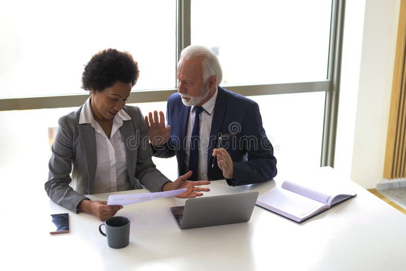 Two Successful Managers Discussing on Business Proposal Stock Image ...