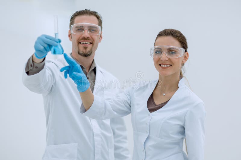 Two Successful Scientists Biologist Looking at the Flask with the ...