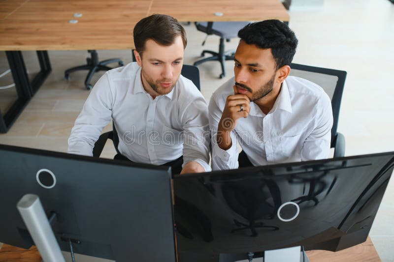 Two Successful Trader in Formalwear Pointing at Display, Analyzing Stat ...
