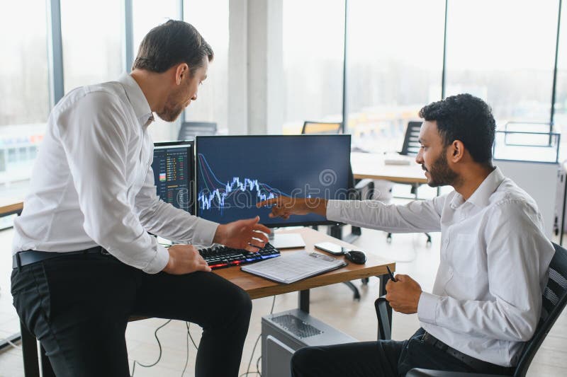 Two Successful Trader in Formalwear Pointing at Display, Analyzing Stat ...