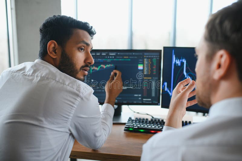 Two Successful Trader in Formalwear Pointing at Display, Analyzing Stat ...
