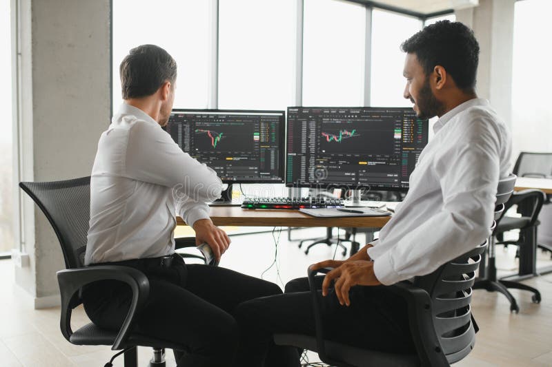 Two Successful Trader in Formalwear Pointing at Display, Analyzing Stat ...