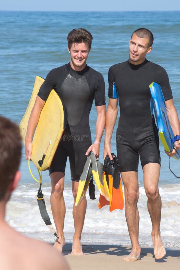 Two Surfer Bodyboard Men on Beach Stock Photo - Image of young, sunrise ...