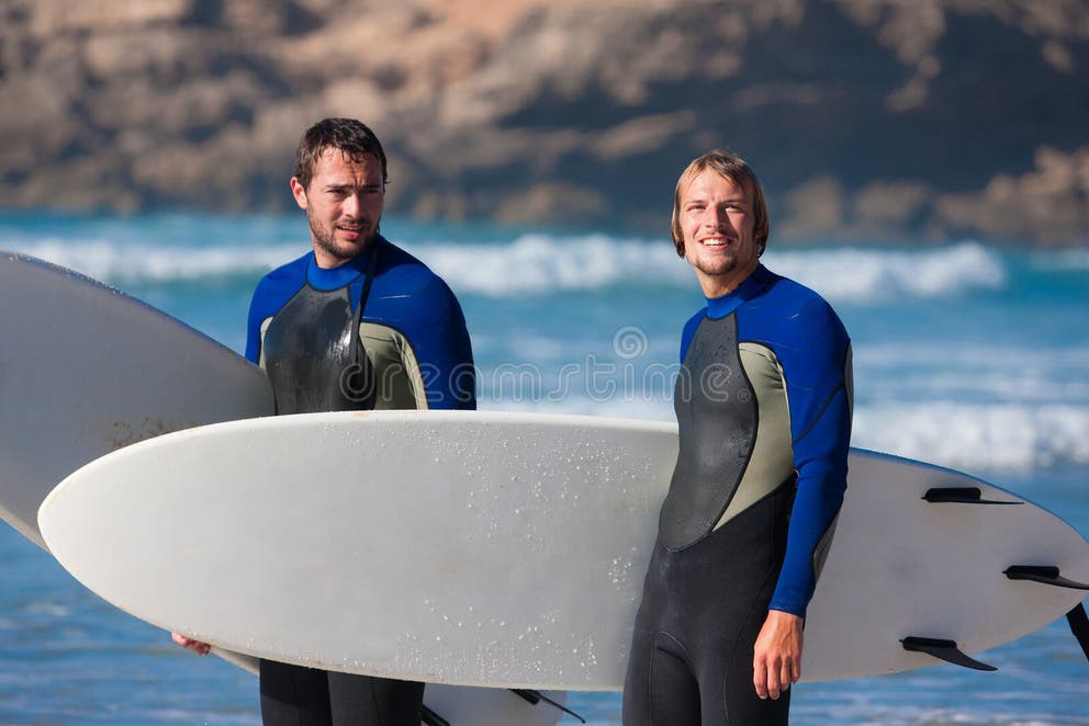 Two Surfers Talking on the Beach Stock Photo - Image of beach, activity ...