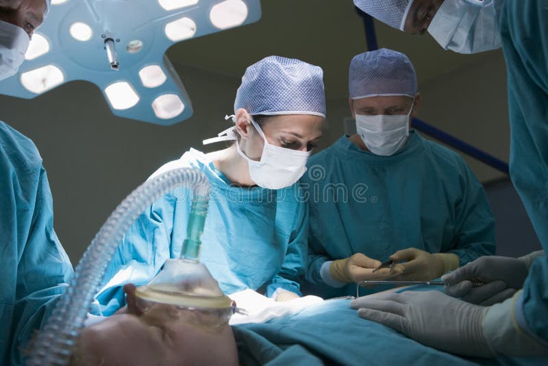 Two Surgeons Operating on a Patient Stock Image - Image of equipment ...